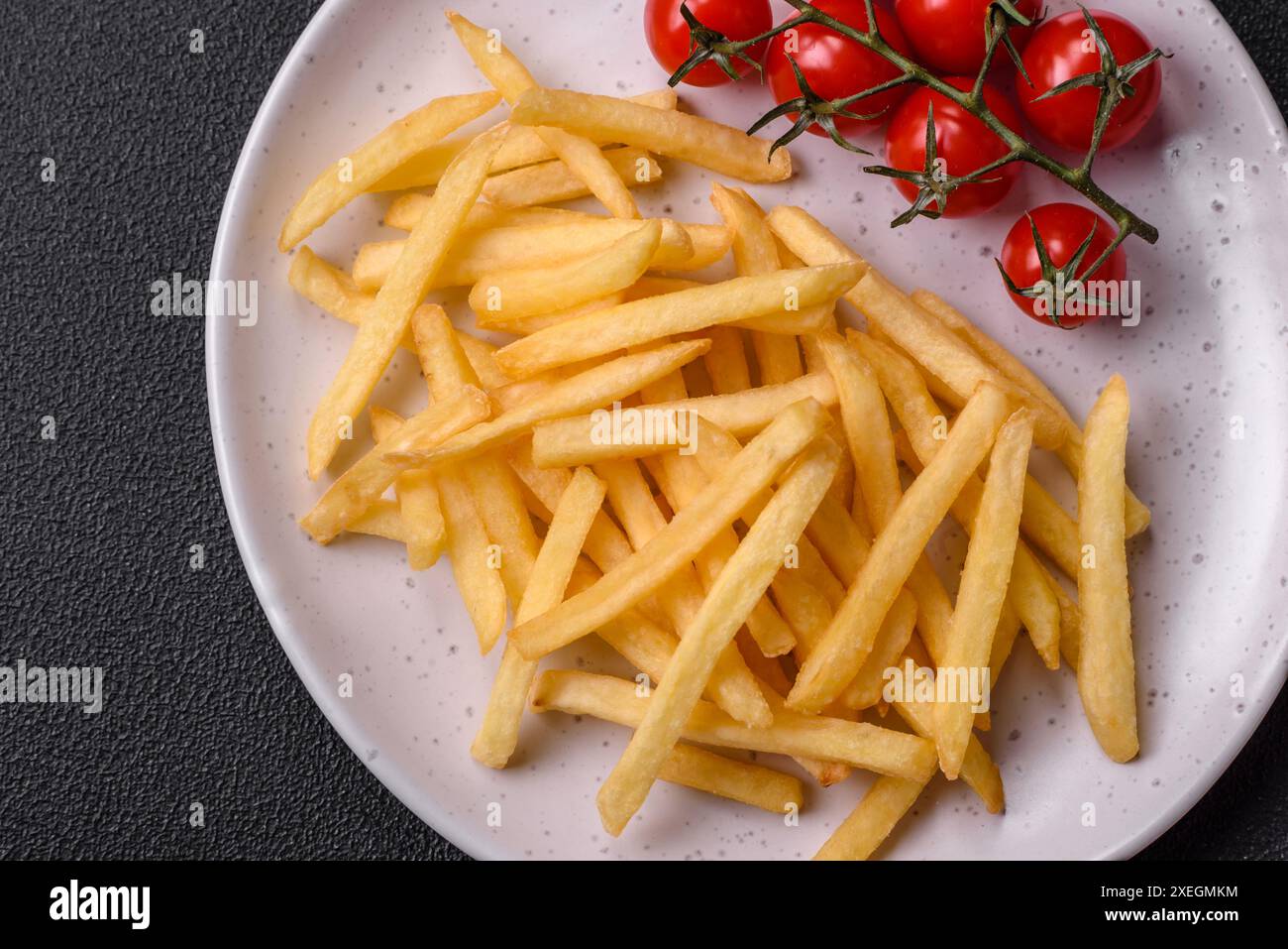 Fresh delicious crispy French fries with salt and spices Stock Photo ...