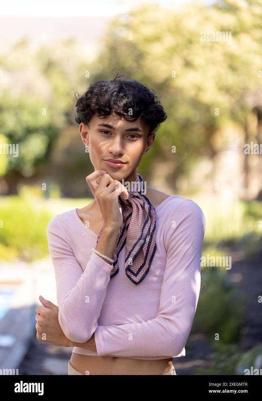 Posing confidently, transgender transgender woman wearing stylish scarf ...
