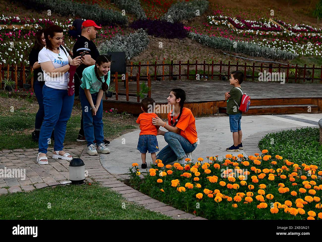 Damascus, Syria. 27th June, 2024. People visit a flower exhibition held ...