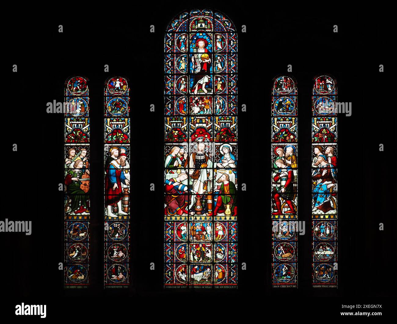 Stained glass alter window showing the Bible story of the wedding at ...
