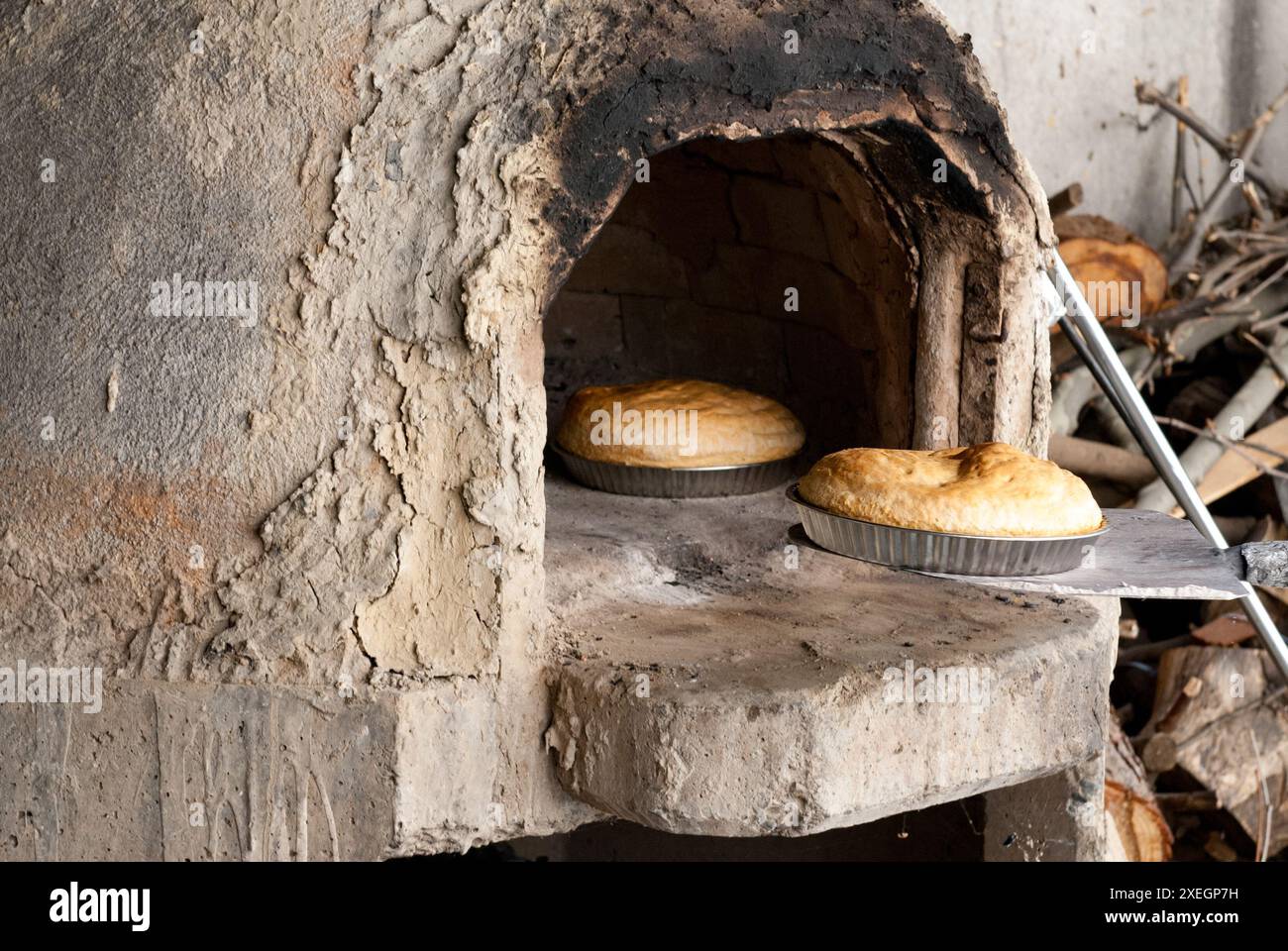 Fresh homemade bread cooked on a traditional clay oven Stock Photo - Alamy