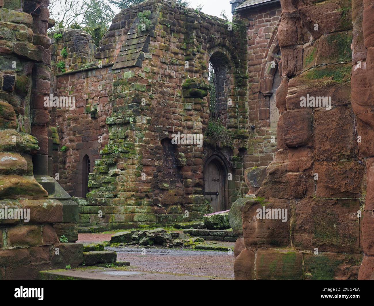 Ruined medieval stone walls of the eastern end of destroyed choir and ...