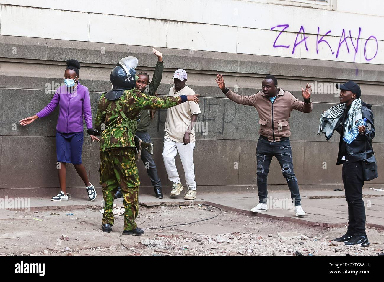 Nairobi, Kenya. 27th June, 2024. Anti-riot police question people on ...