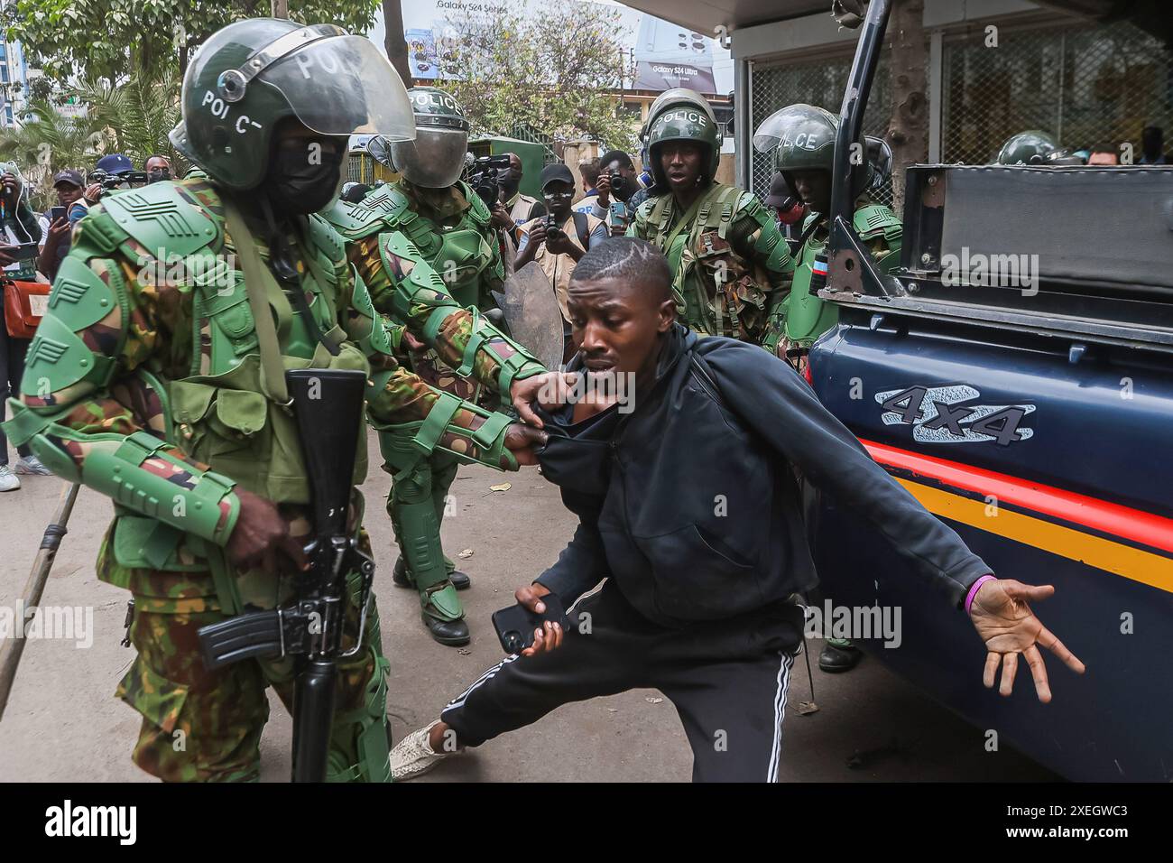 Nairobi, Kenya. 27th June, 2024. Anti-riot police arrest a demonstrator ...