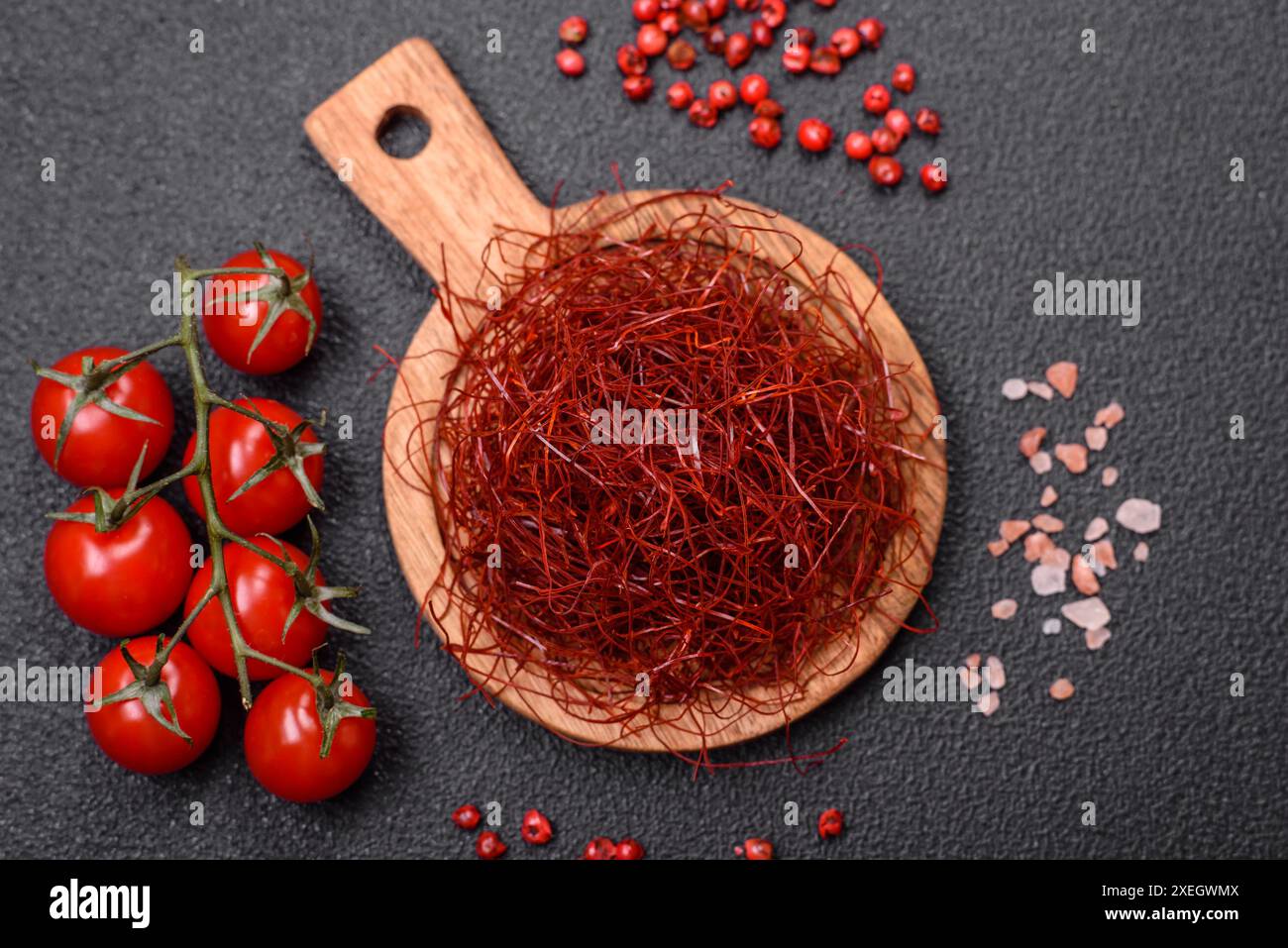 Red thin hot chili threads on a dark background. For decorating Asian ...