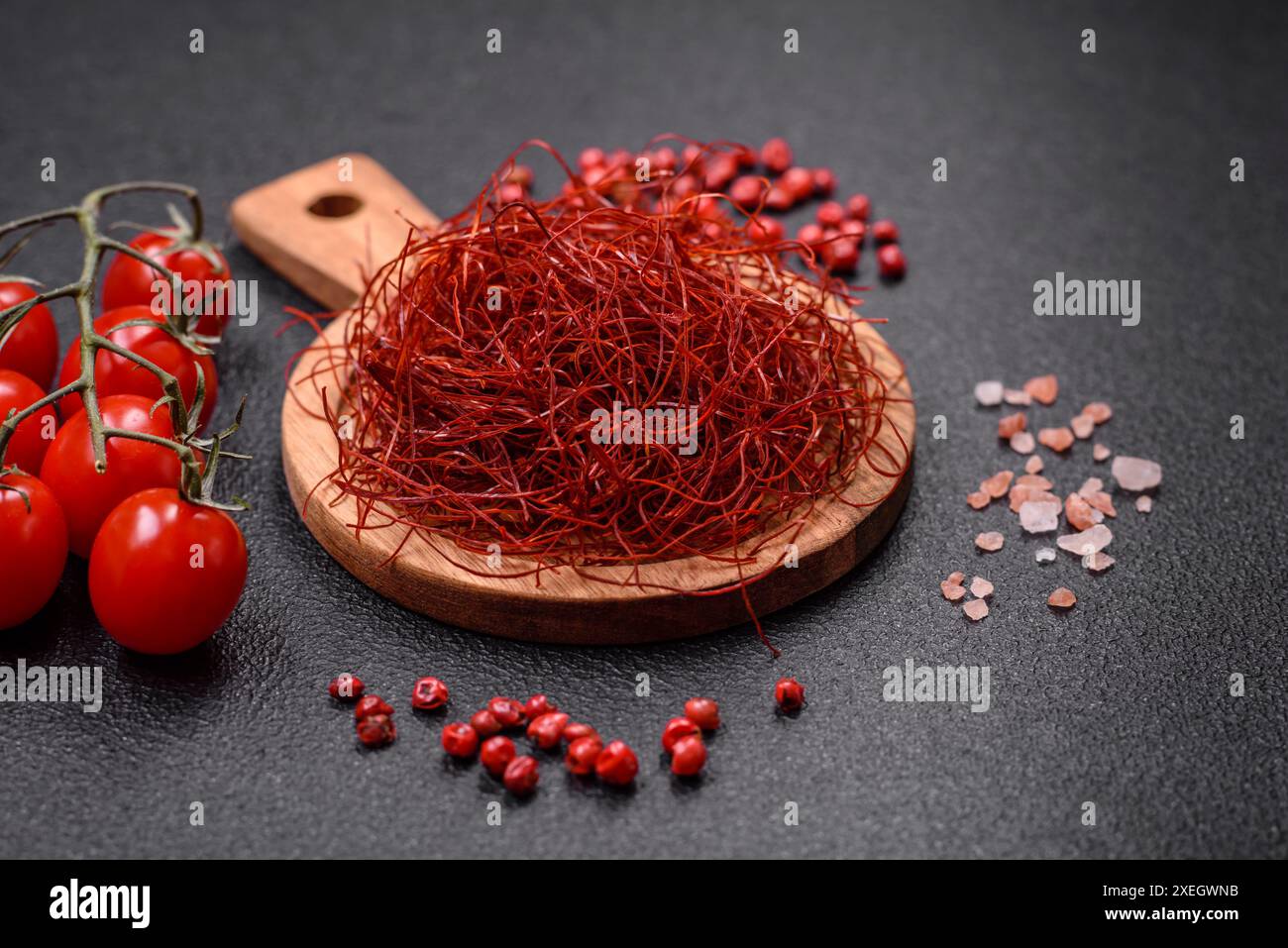 Red thin hot chili threads on a dark background. For decorating Asian ...
