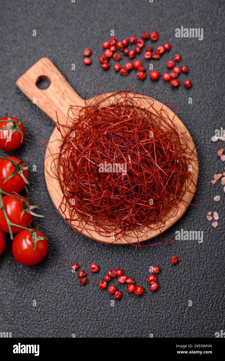 Red thin hot chili threads on a dark background. For decorating Asian ...