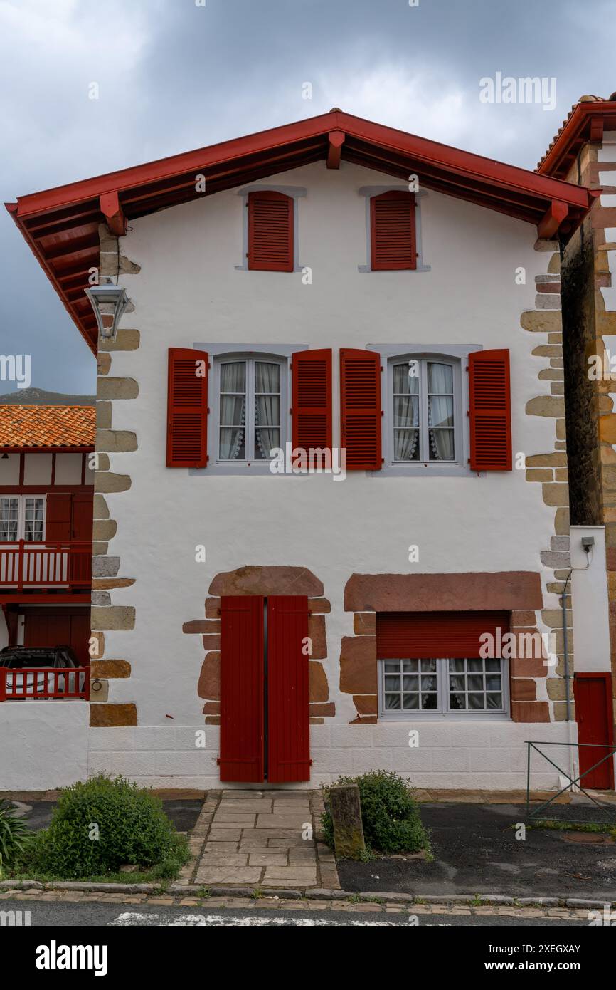 Typical colourful Basque house in the mountain village of Ainhoa in the ...
