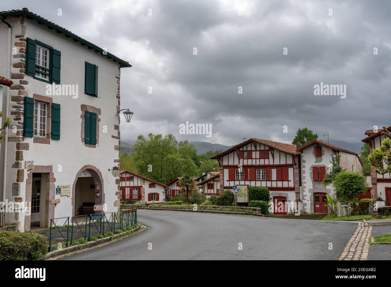 Typical colourful Basque houses in the mountain village of Ainhoa in ...