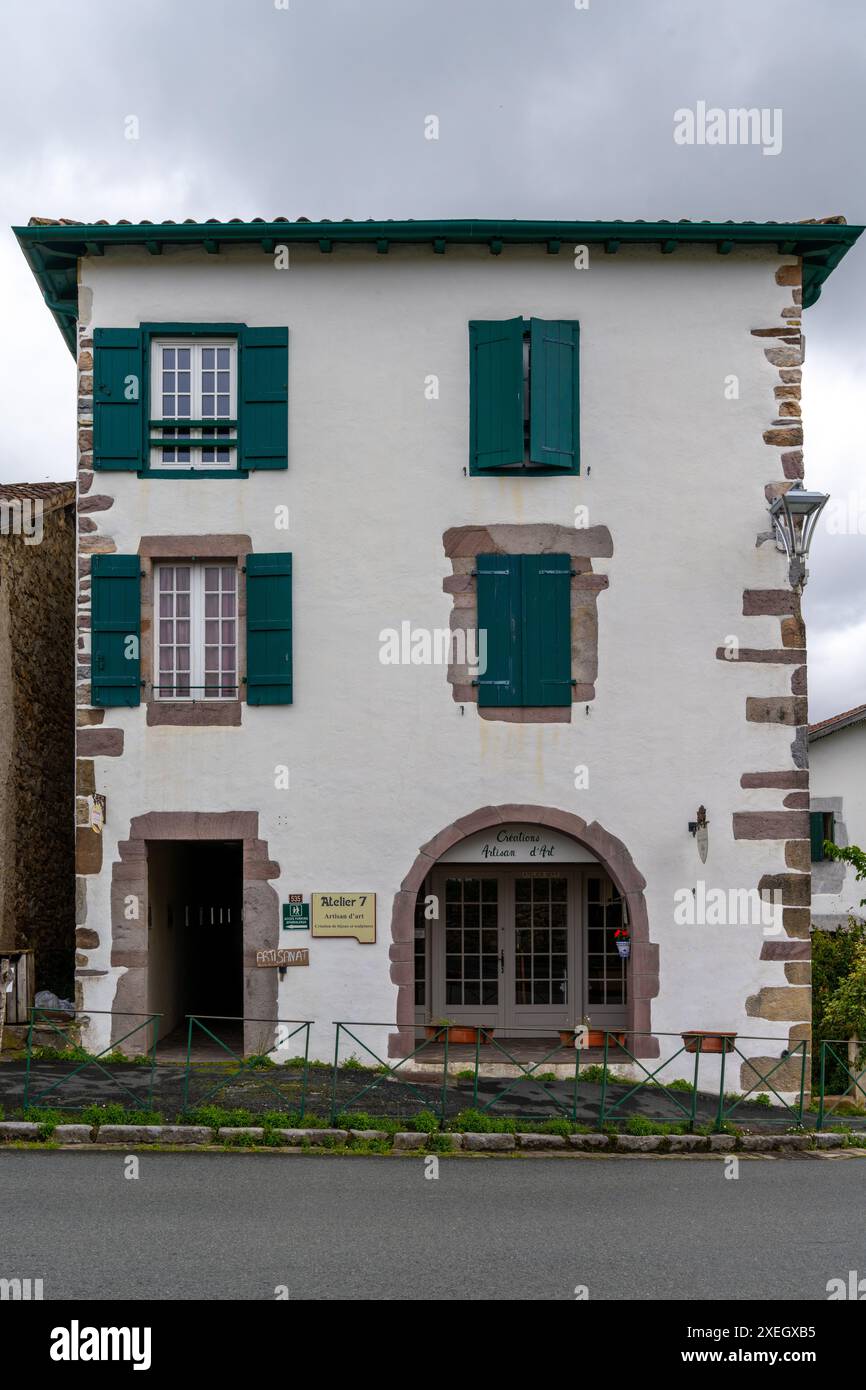 Typical colourful Basque house in the mountain village of Ainhoa in the ...