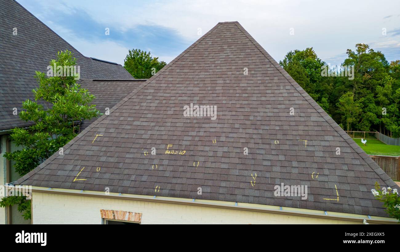 Roof with hail damage and marking from hail insurance inspection Stock ...