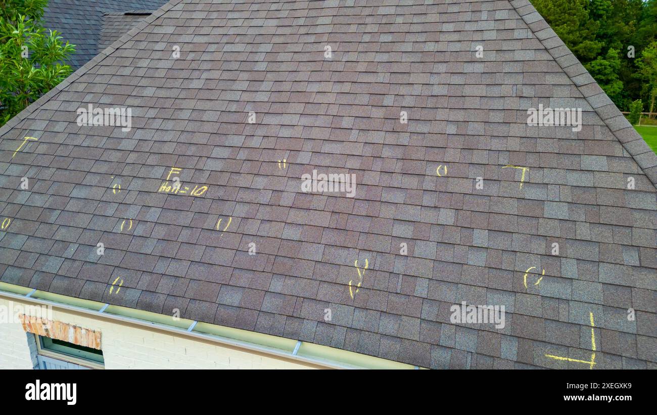 Roof with hail damage and marking from hail insurance inspection Stock ...