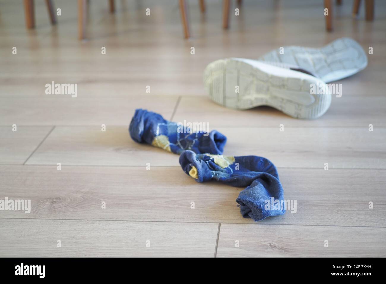 dirty sock and shoe on floor Stock Photo - Alamy