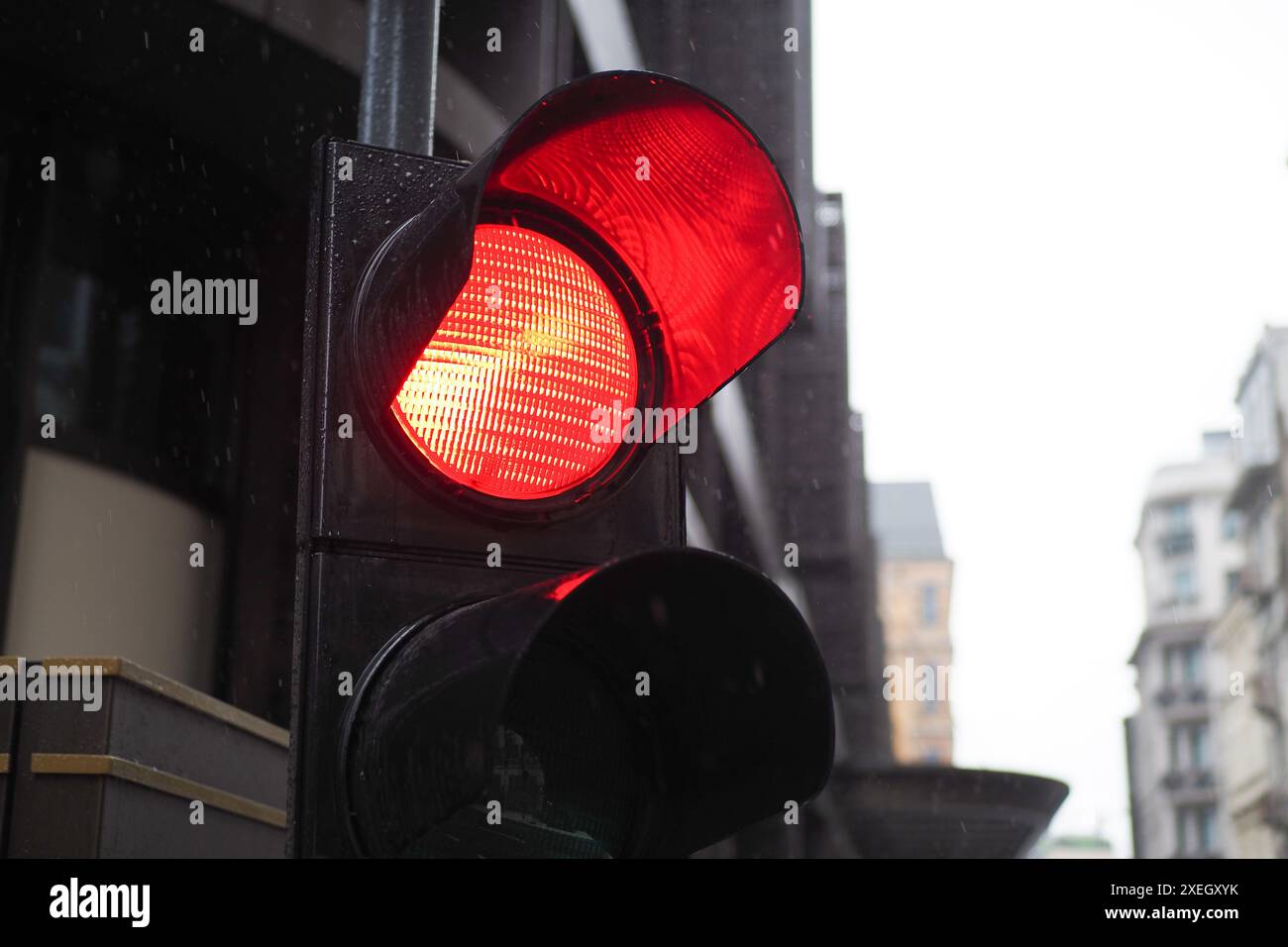 Red Traffic Light Signal on City Street, Stop Sign with Urban Building ...