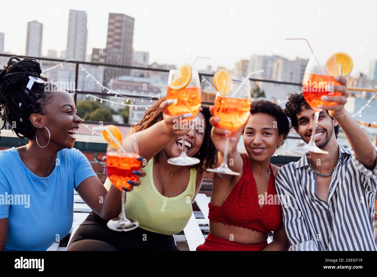 Four young cheerful multiethnic friends hi-res stock photography and ...
