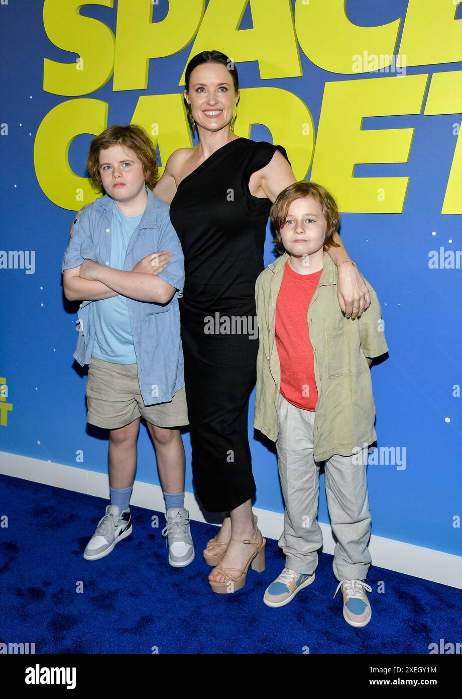 Writer-director Liz W. Garcia, center, poses with sons August and ...