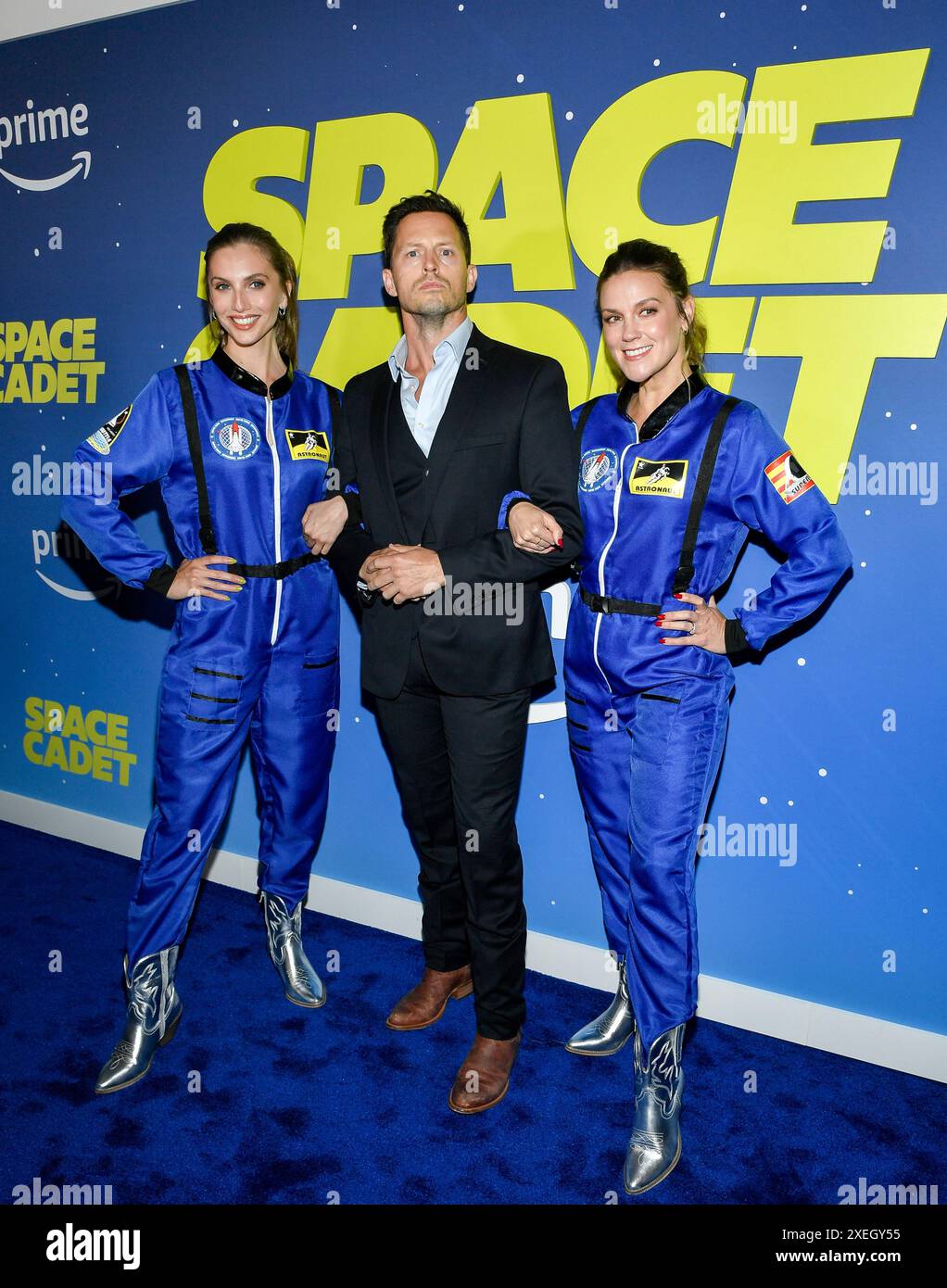 Actor Andrew Call, center, poses with space cadet models at the Amazon ...