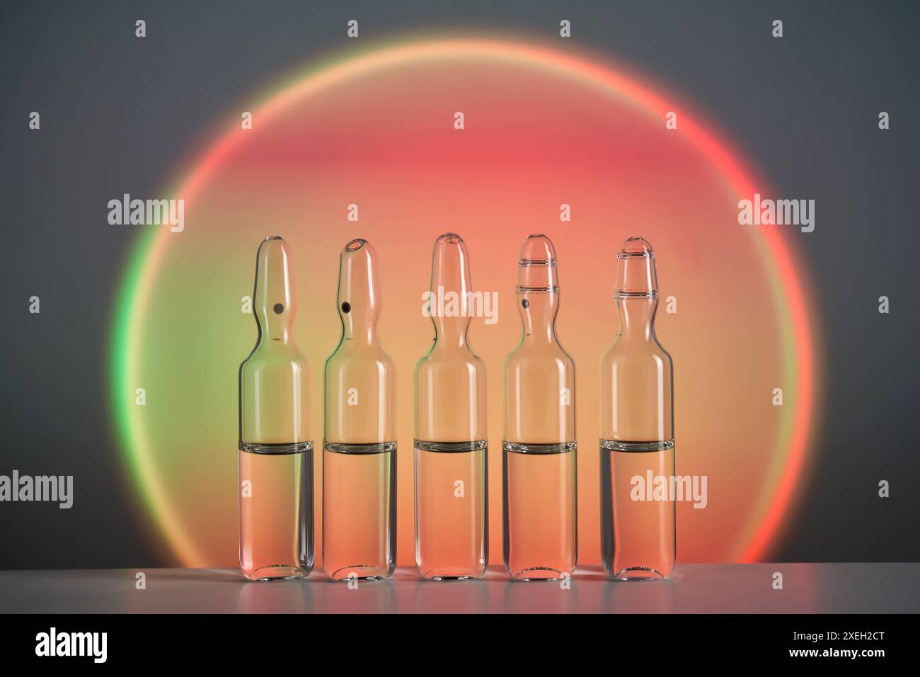 Ampoules injection against background hi-res stock photography and ...