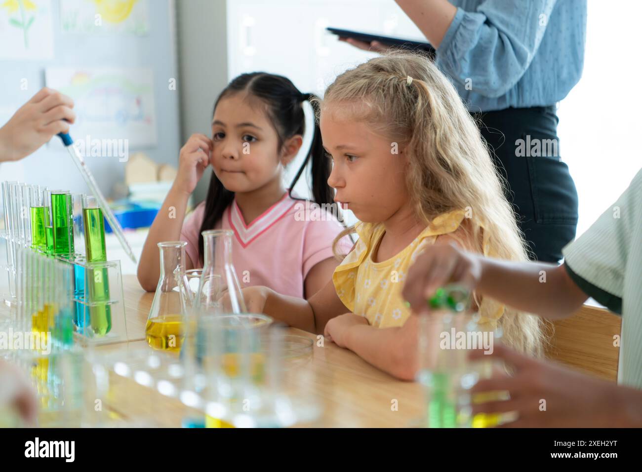 Teacher and students, Learn and experiment with science in a school ...