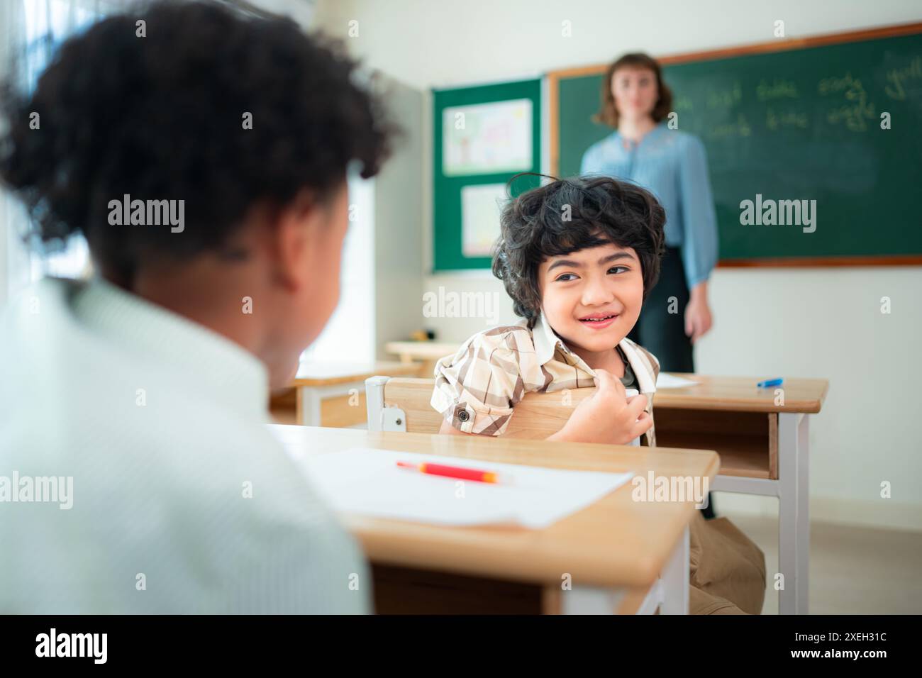School kids talking in classroom hi-res stock photography and images ...
