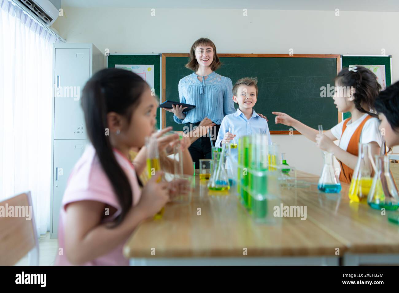 Teacher and students, Learn and experiment with science in a school ...