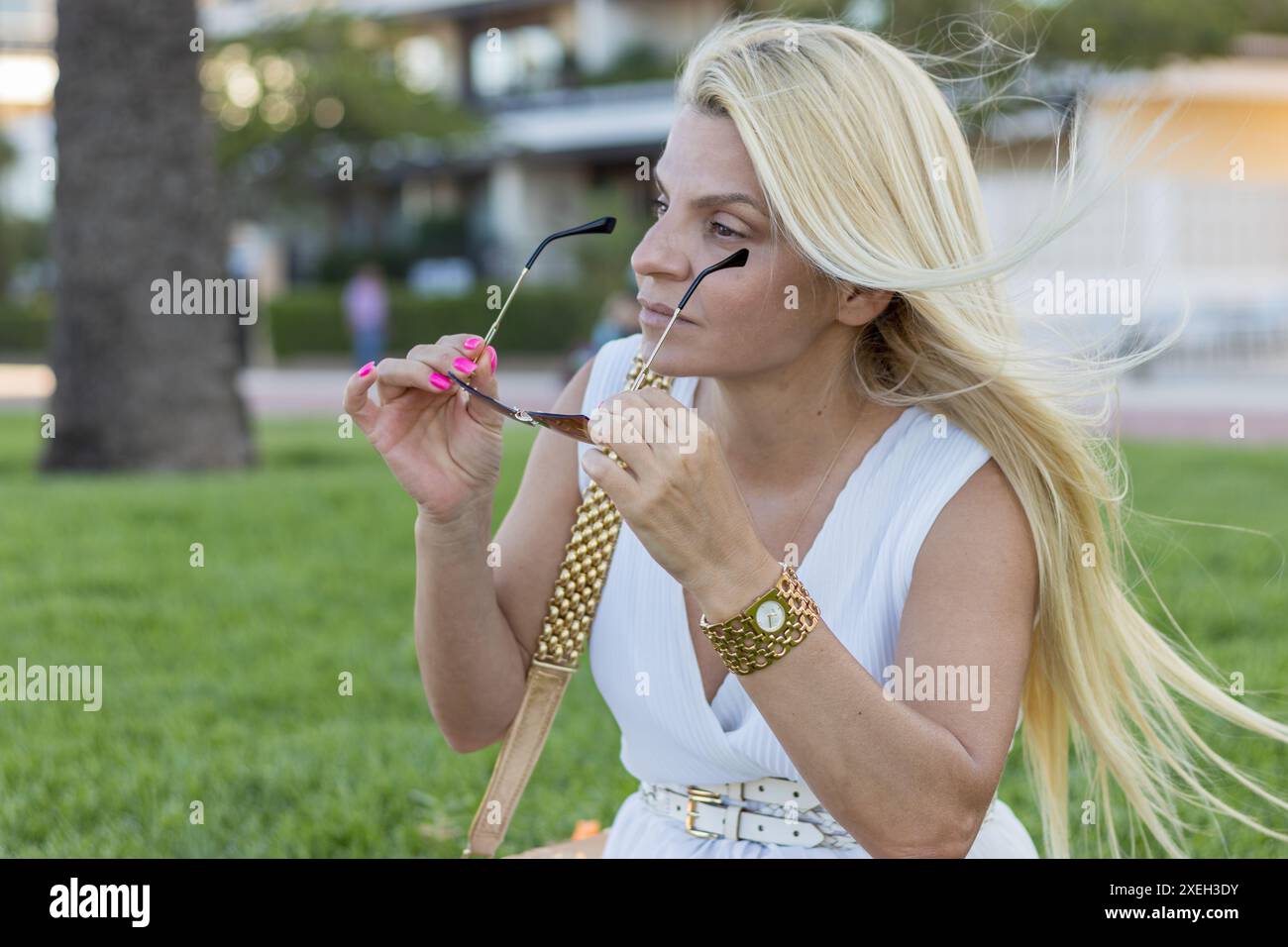 Woman seated engaging in hi-res stock photography and images - Alamy