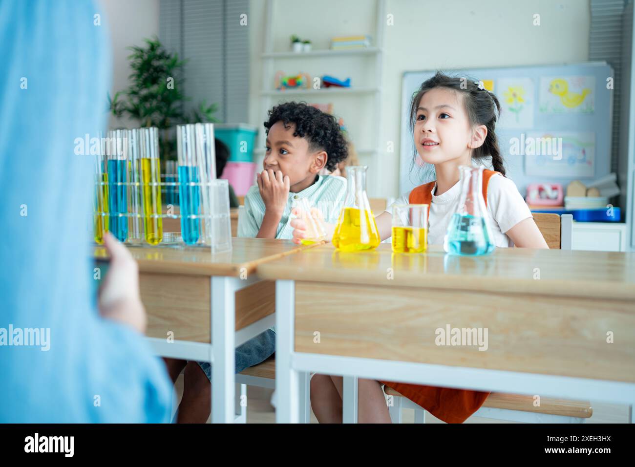 Teacher and students, Learn and experiment with science in a school ...