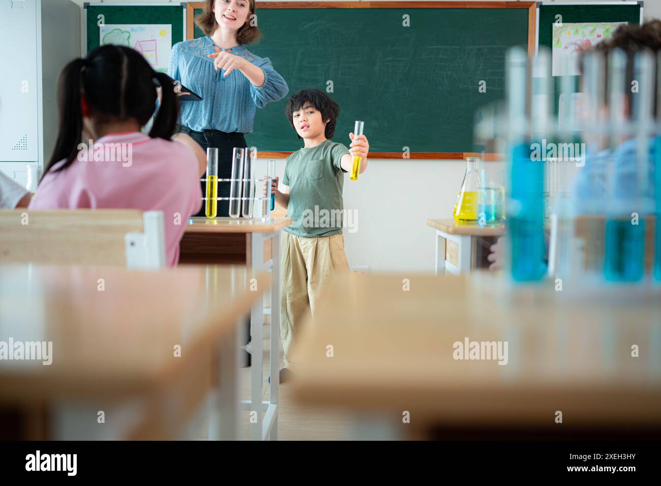 Teacher and students, Learn and experiment with science in a school ...