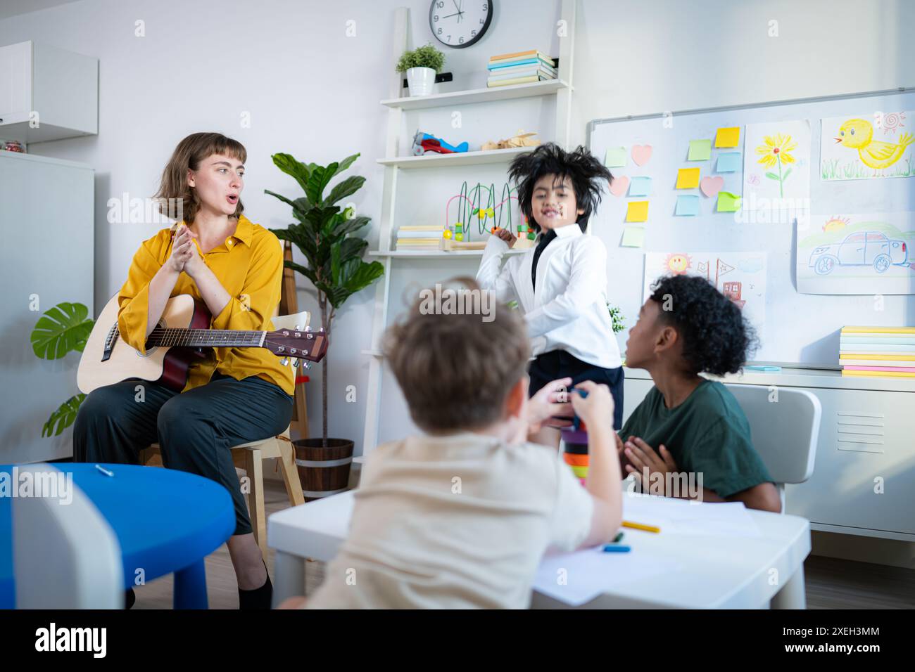 In class, The teacher and students sing together, and the boys dance ...