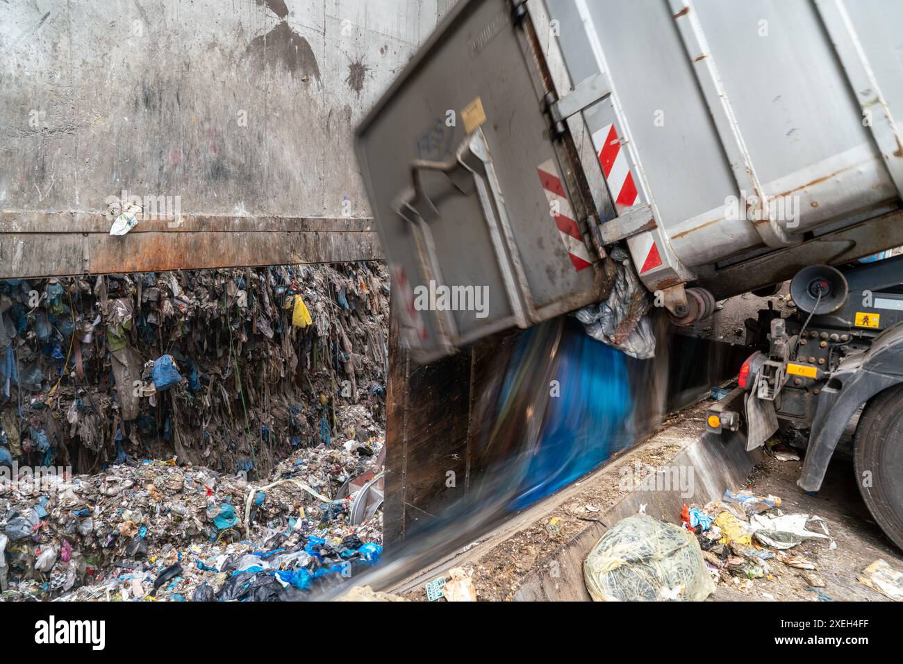 Garbage is delivered and dumped into the garbage bunker Stock Photo - Alamy