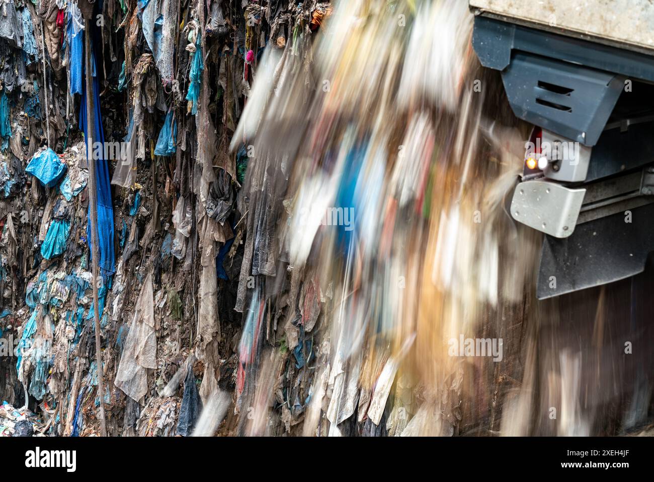 Garbage is delivered and dumped into the garbage bunker Stock Photo - Alamy