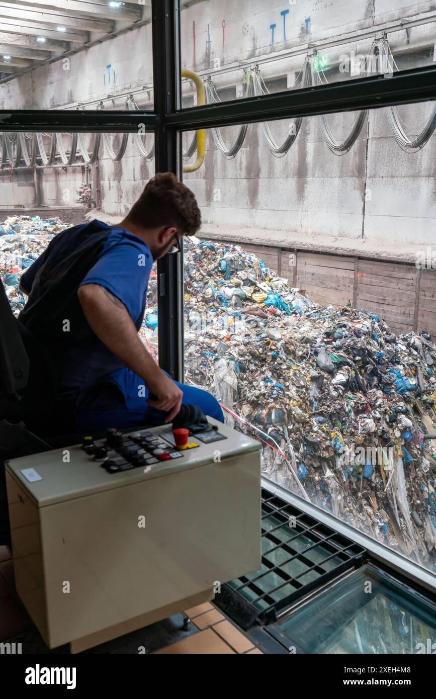 View from the crane into the waste bunker of a waste-to-energy plant ...