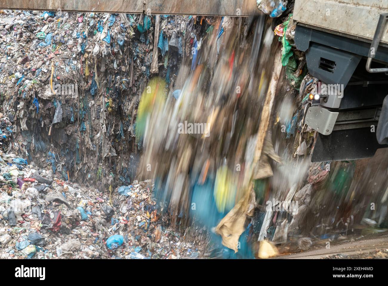 Garbage is delivered and dumped into the garbage bunker Stock Photo - Alamy