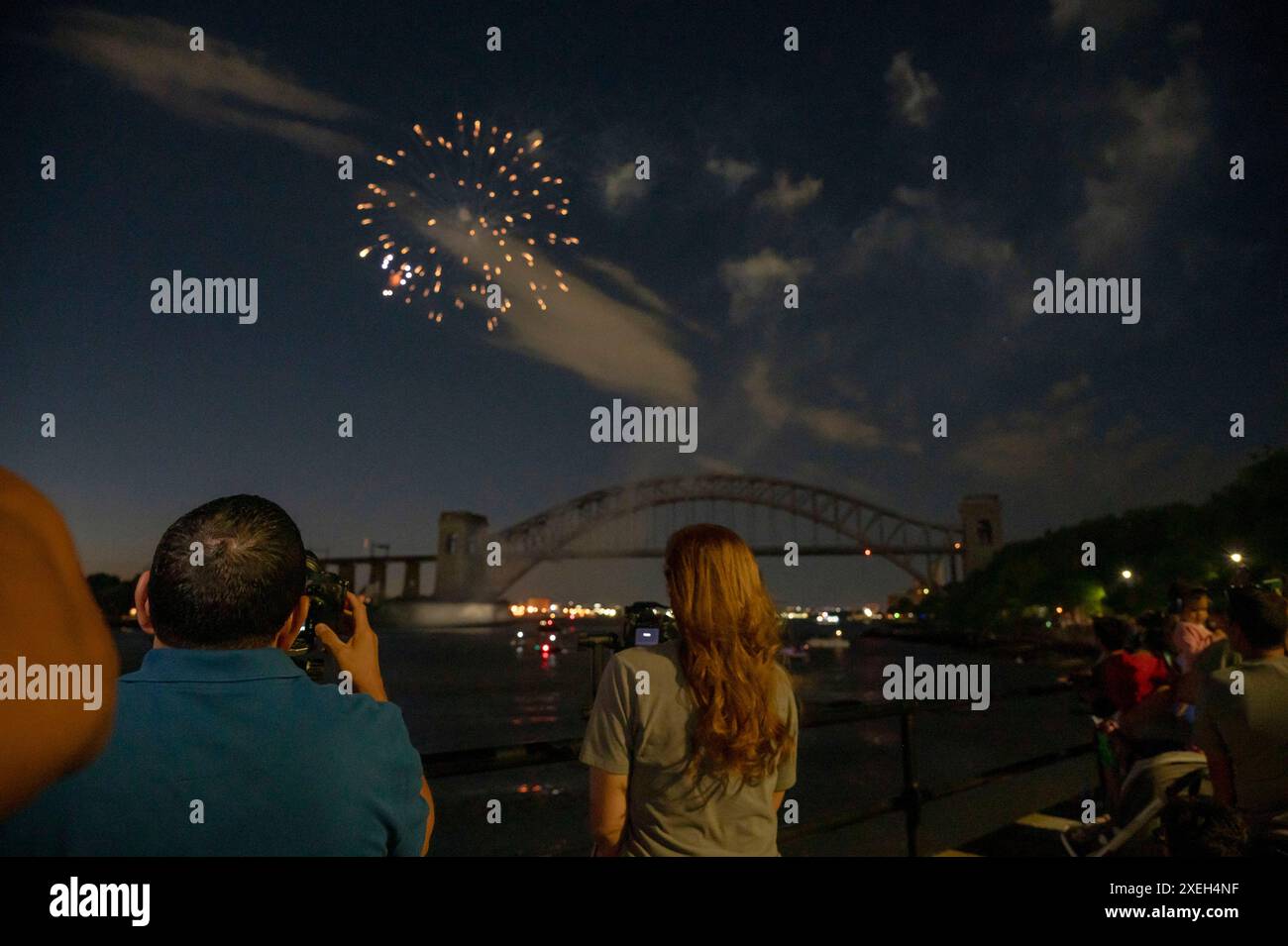 NEW YORK, NEW YORK - JUNE 27: Spectators photograph the fireworks ...