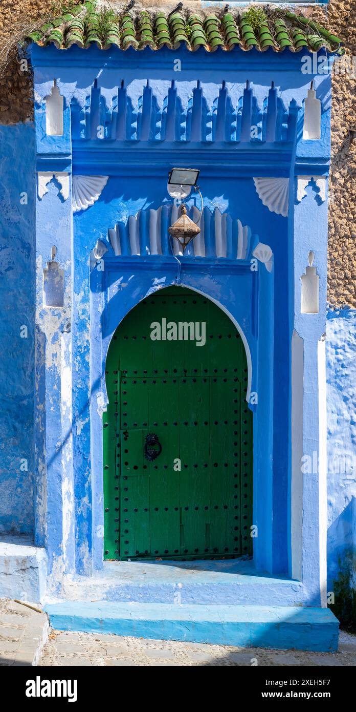 Close-up view of a house front and door in the historic blue city of ...