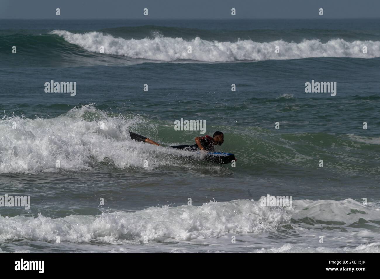 Man on a boogie baord at the Sidi Ifni surf spot in southern Morocco ...