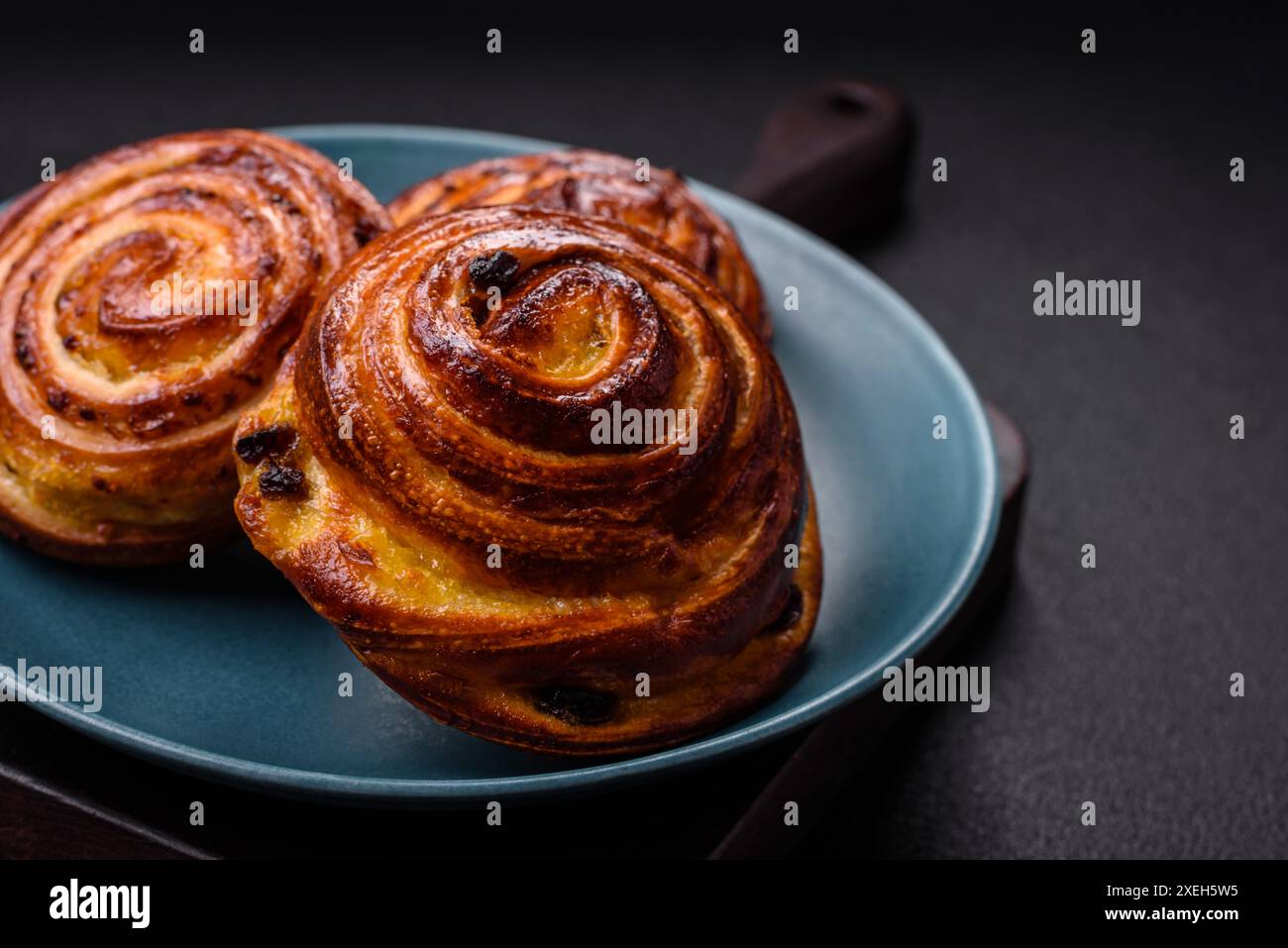 Delicious baked cinnamon raisin rolls in the form of rolls Stock Photo ...