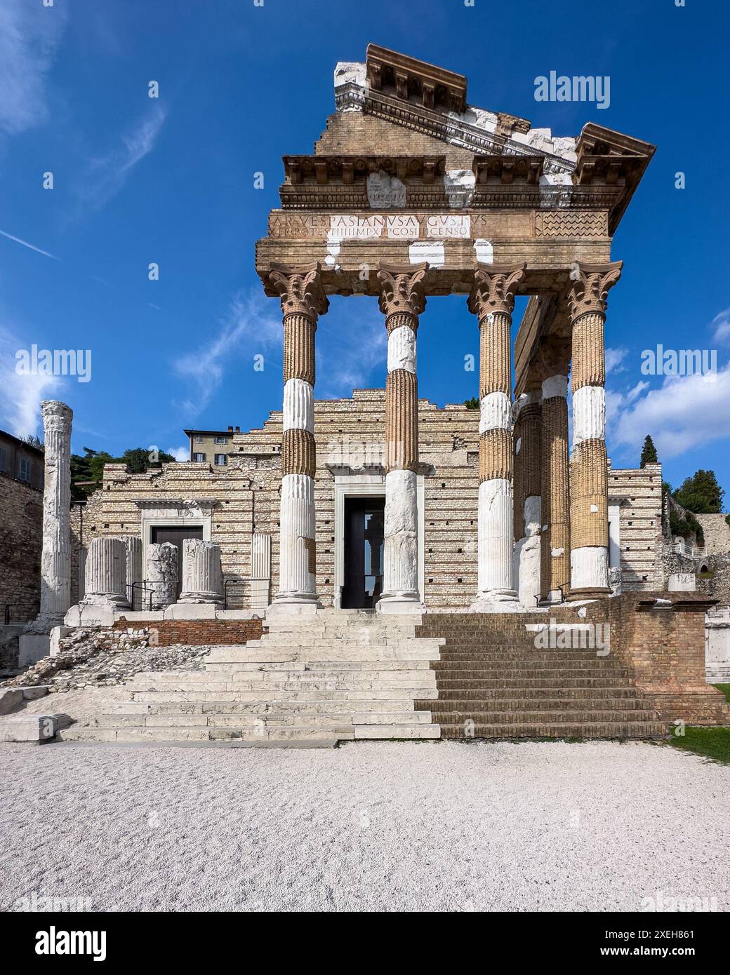Ancient Roman temple ruins in Brescia, Italy, under a clear blue sky ...
