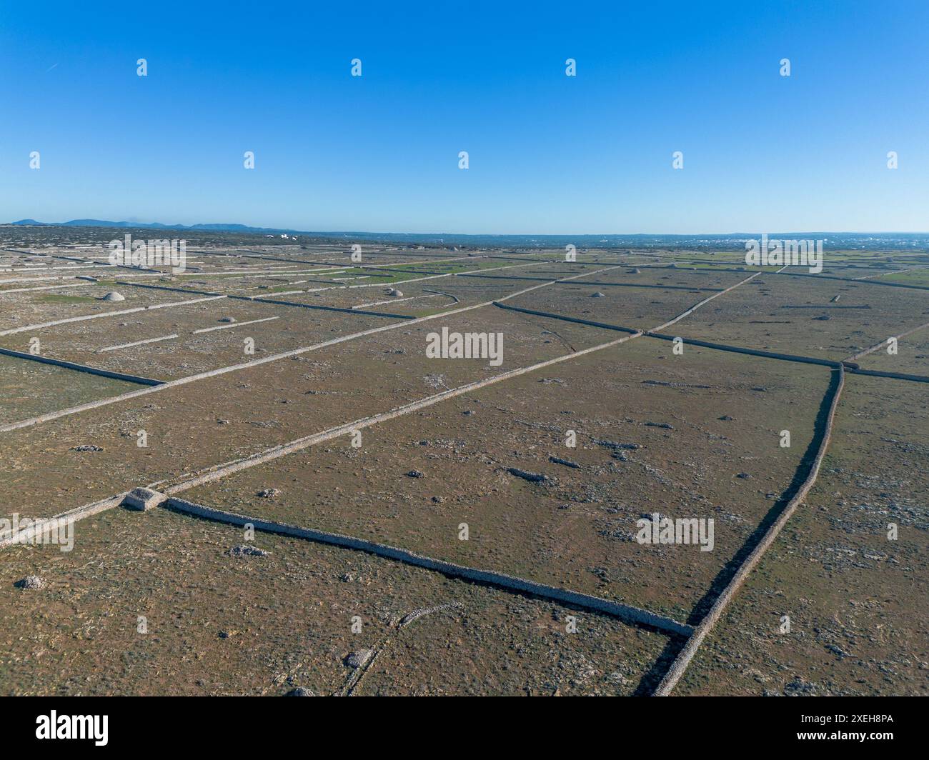 View of the typical stone walls and fields encasing the historic ...