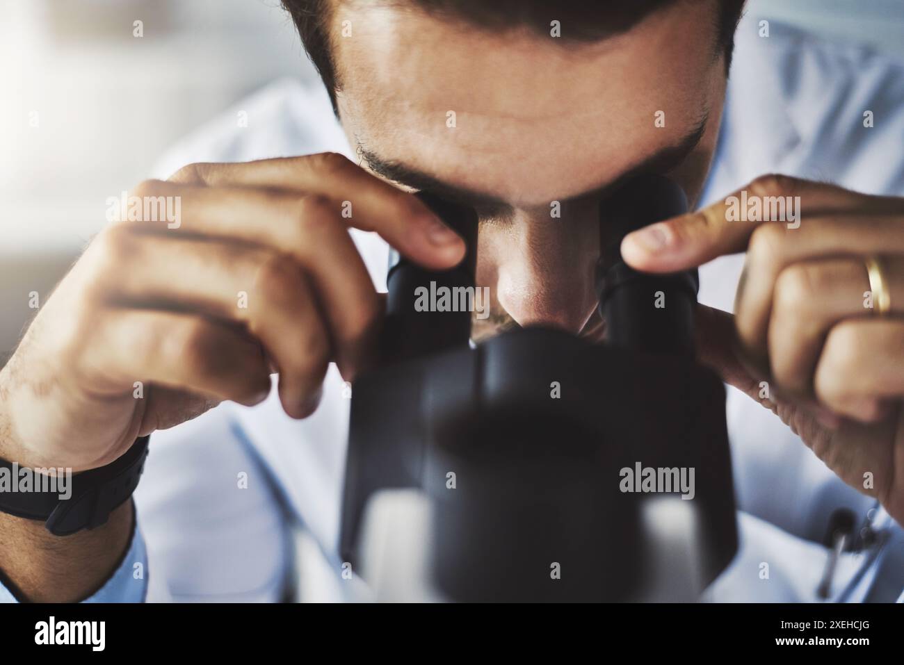 Man, science and microscope for research in laboratory for medical ...