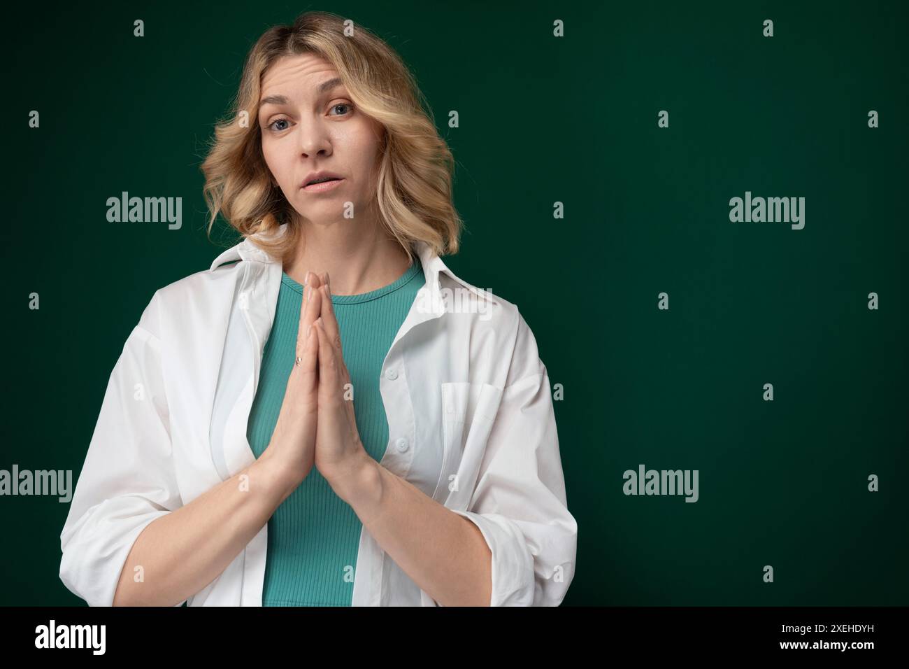 Woman praying quietly on hi-res stock photography and images - Alamy
