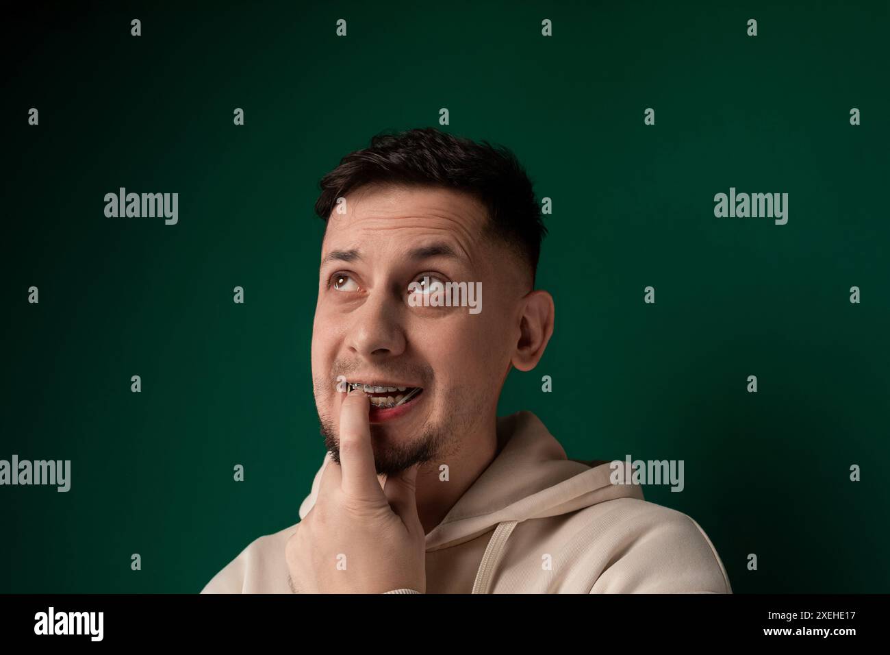 Man Making Funny Face With Finger Stock Photo - Alamy