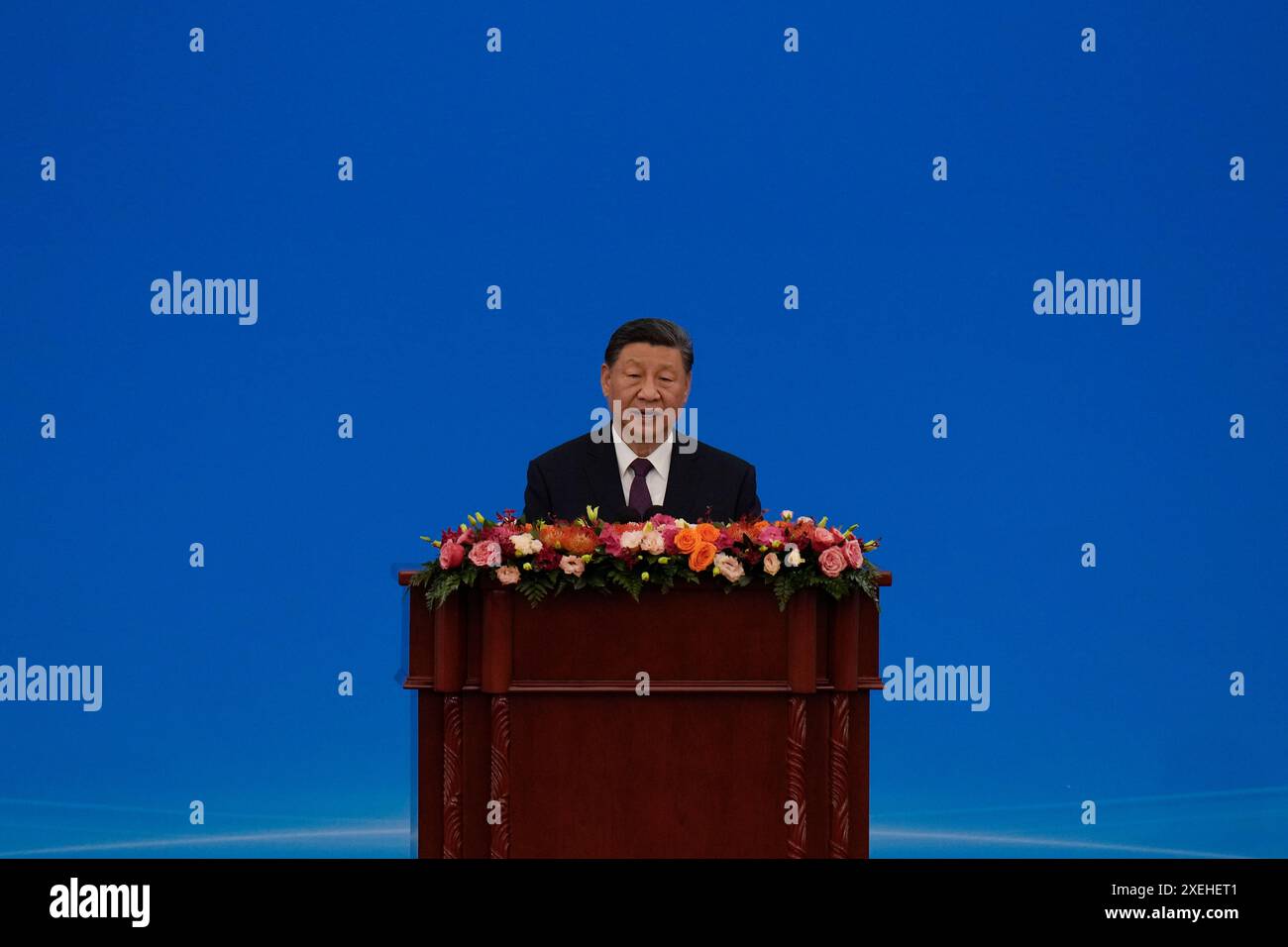 Chinese President Xi Jinping delivers his speech at a conference ...