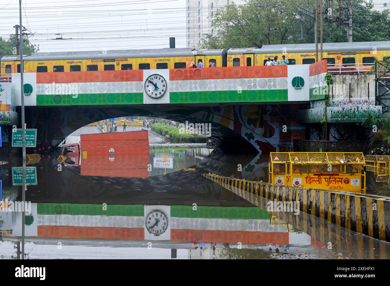 A lorry is stuck in clogged water under Minto rail Bridge after a heavy rain in New Delhi, India ...