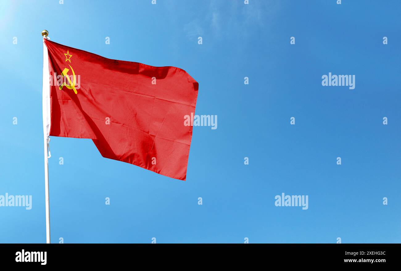 Soviet Union flag on cloudy sky. waving in the sky Stock Photo - Alamy