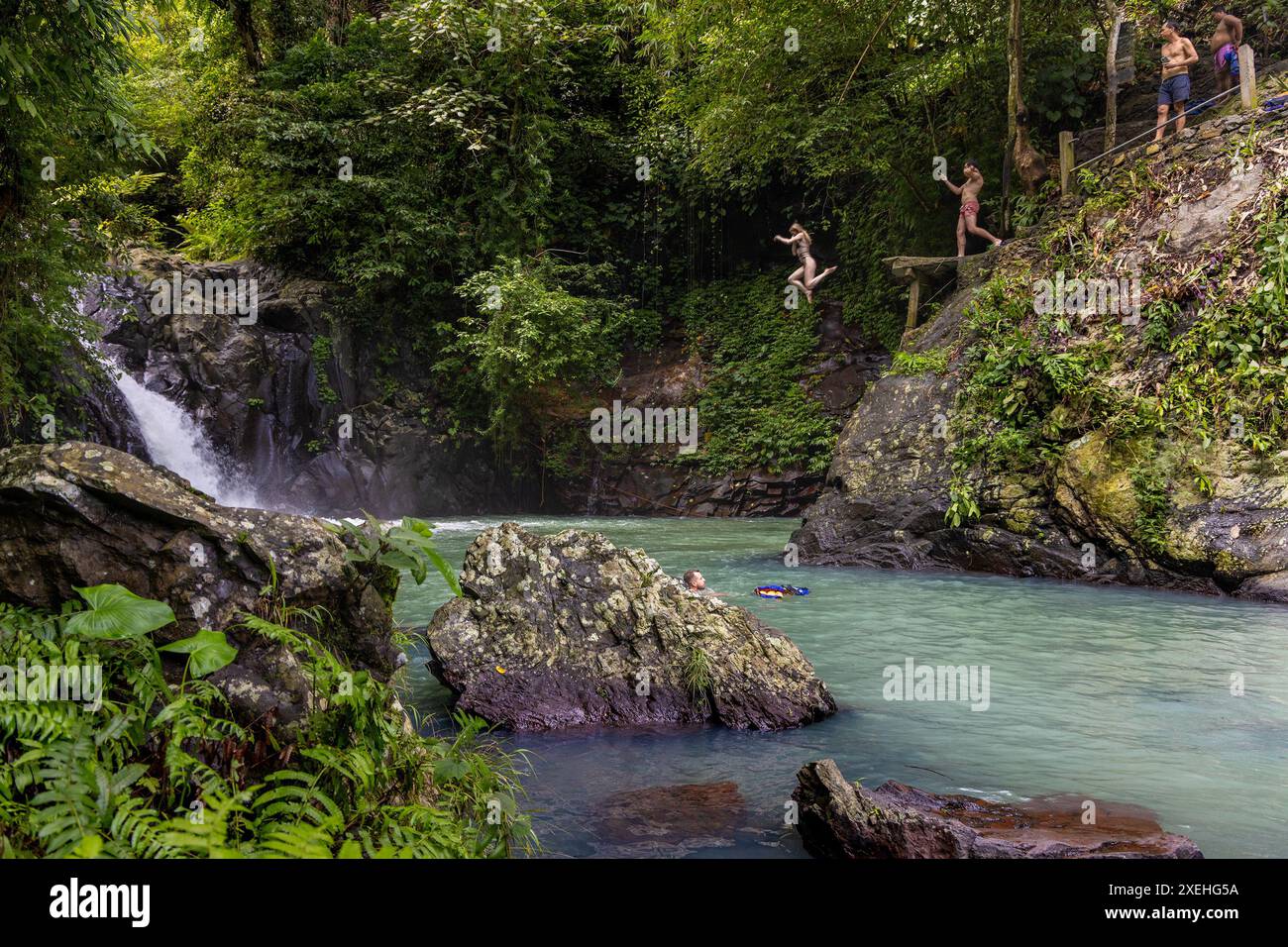People at the Aling Aling Waterfall in Bali Island, Indonesia Stock ...
