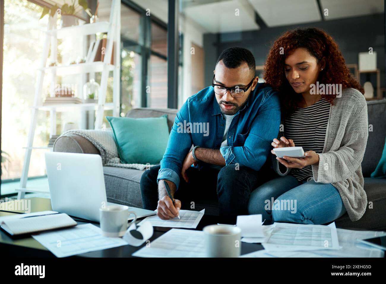 Calculator, budget checklist or couple writing with financial paperwork ...