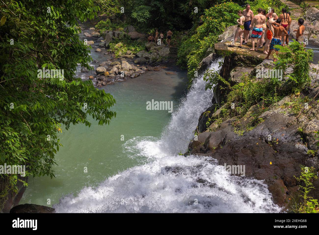 People at the Aling Aling Waterfall in Bali Island, Indonesia Stock ...