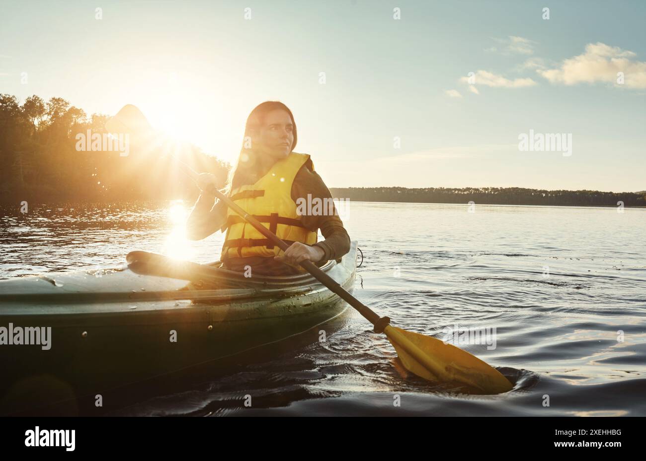 Girl, thinking and outdoor on lake or kayak or water sports, rowing and ...
