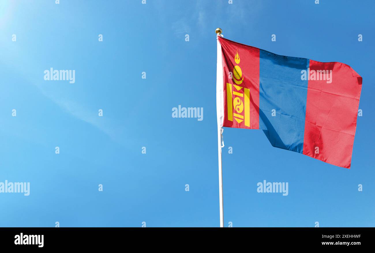 Mongolian flag in the cloudy sky. waving in the sky Stock Photo - Alamy